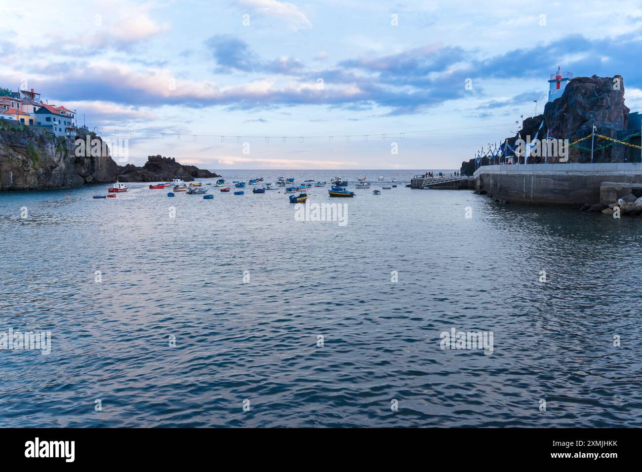 Boats moored up in Camara de Lobos harbour as darkness falls, Madeira ...