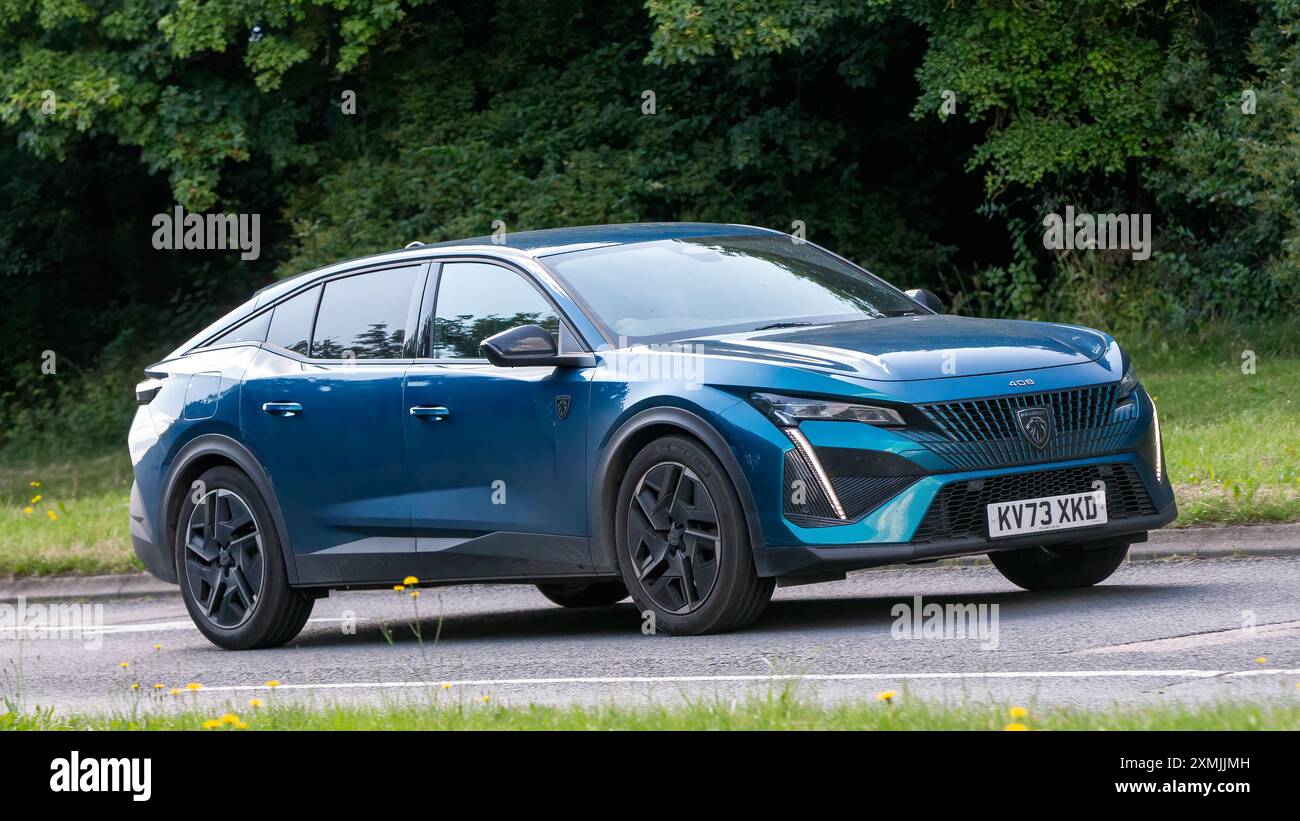 Milton Keynes,UK - July 18th 2024: 2023 blue Peugeot 408 gt car driving ...
