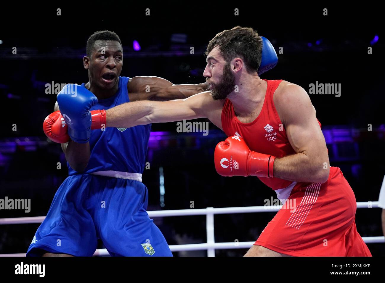 Britain's Patrick Brown, right, fights Brazil's Keno Machado, left, in ...