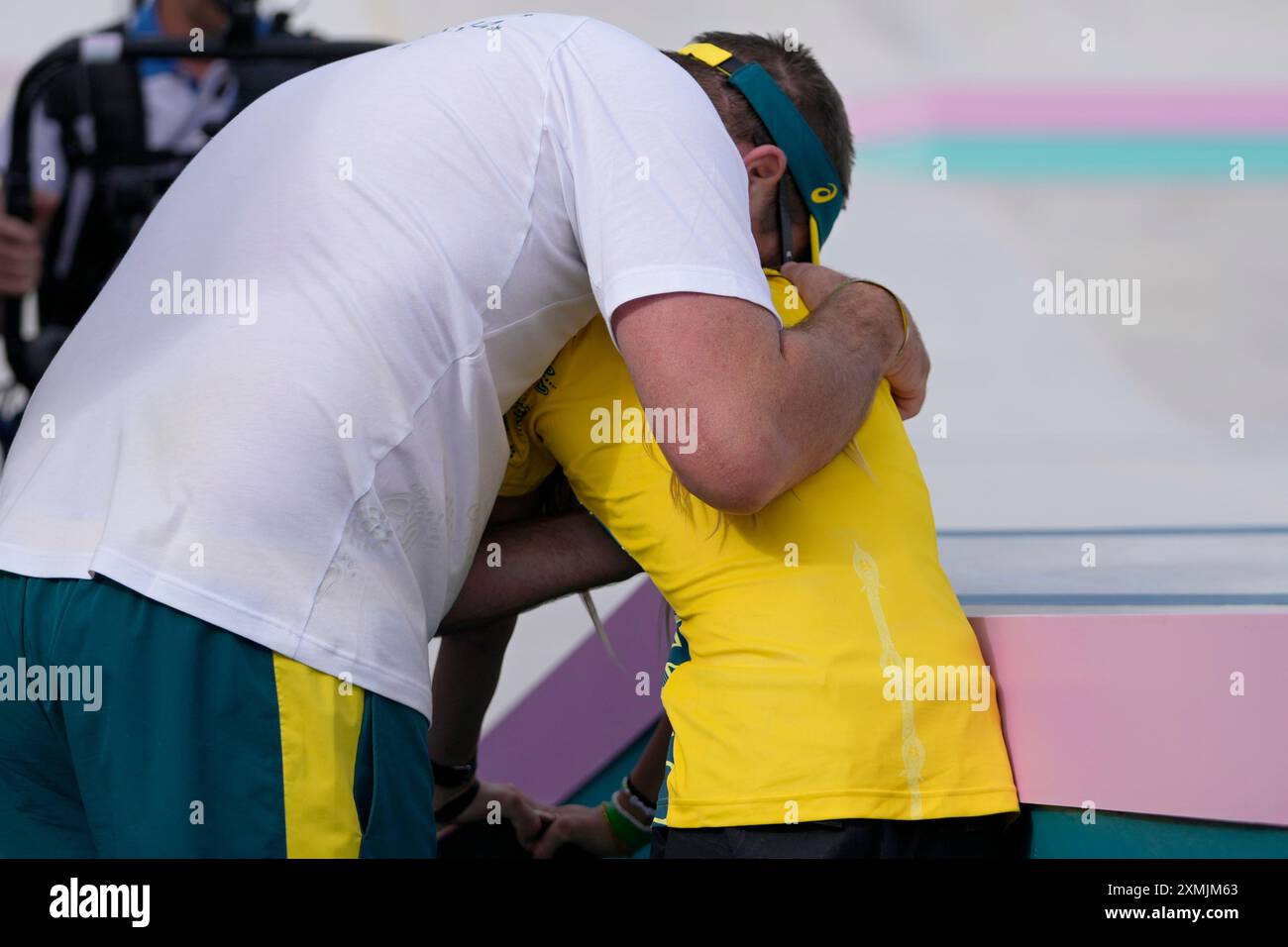 Former New Zealand rugby player Luke Covell embraces his daughter Chloe ...