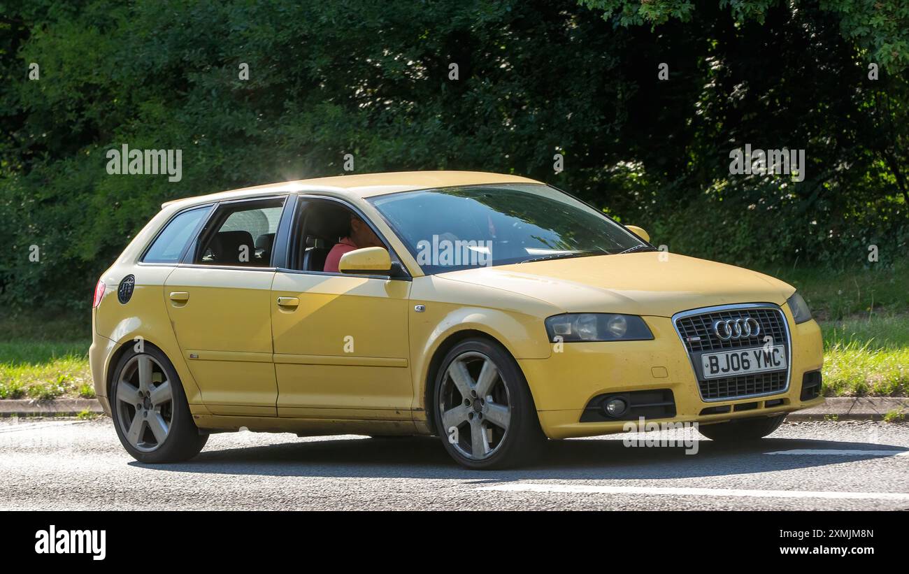 Milton Keynes,UK - July 18th 2024: 2006 yellow Audi A3 car driving on a ...
