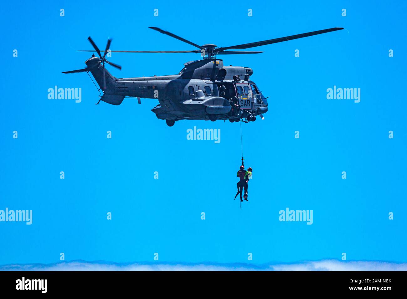 Spanish military SAR Squadron performing an air rescue Stock Photo - Alamy