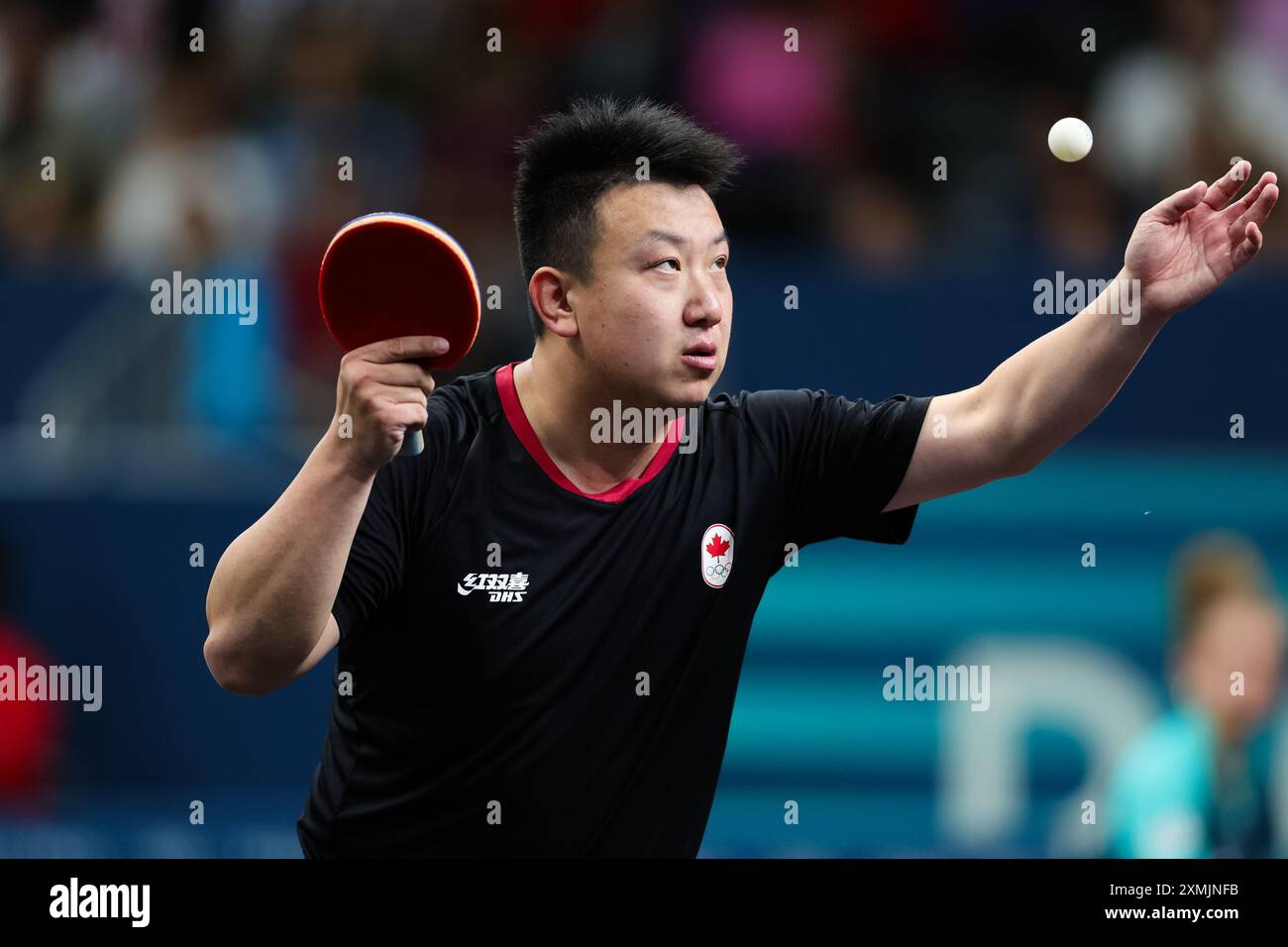Paris, France, 28 July, 2024. Eugene Wang serves during the Men’s Table Tennis Round of 64 match ...