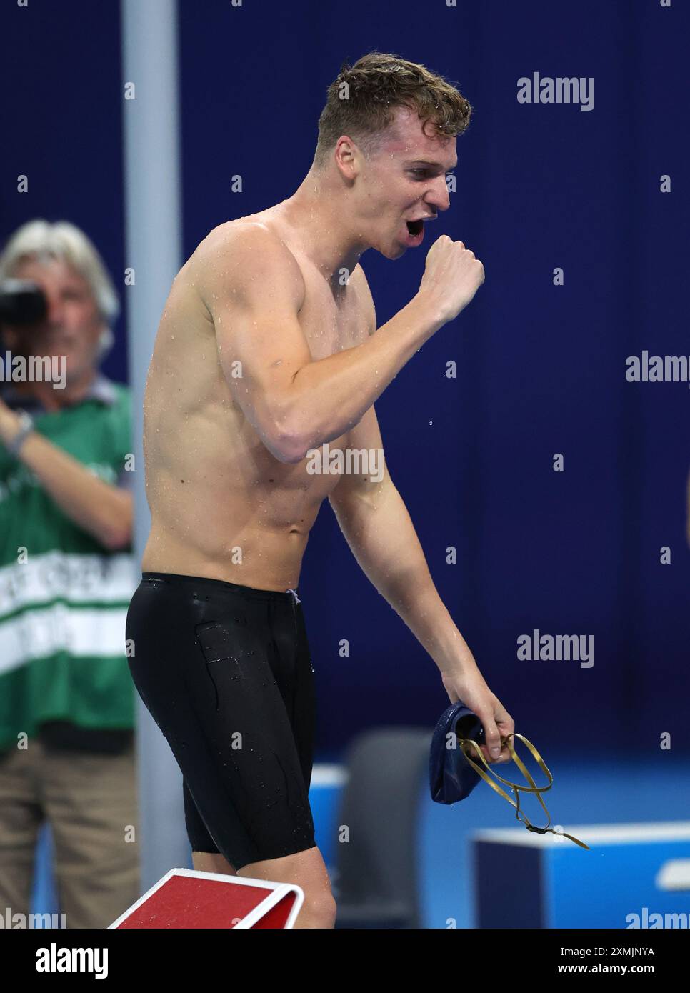 Paris, France. July 28th 2024. France's Leon Marchand celebrates ...