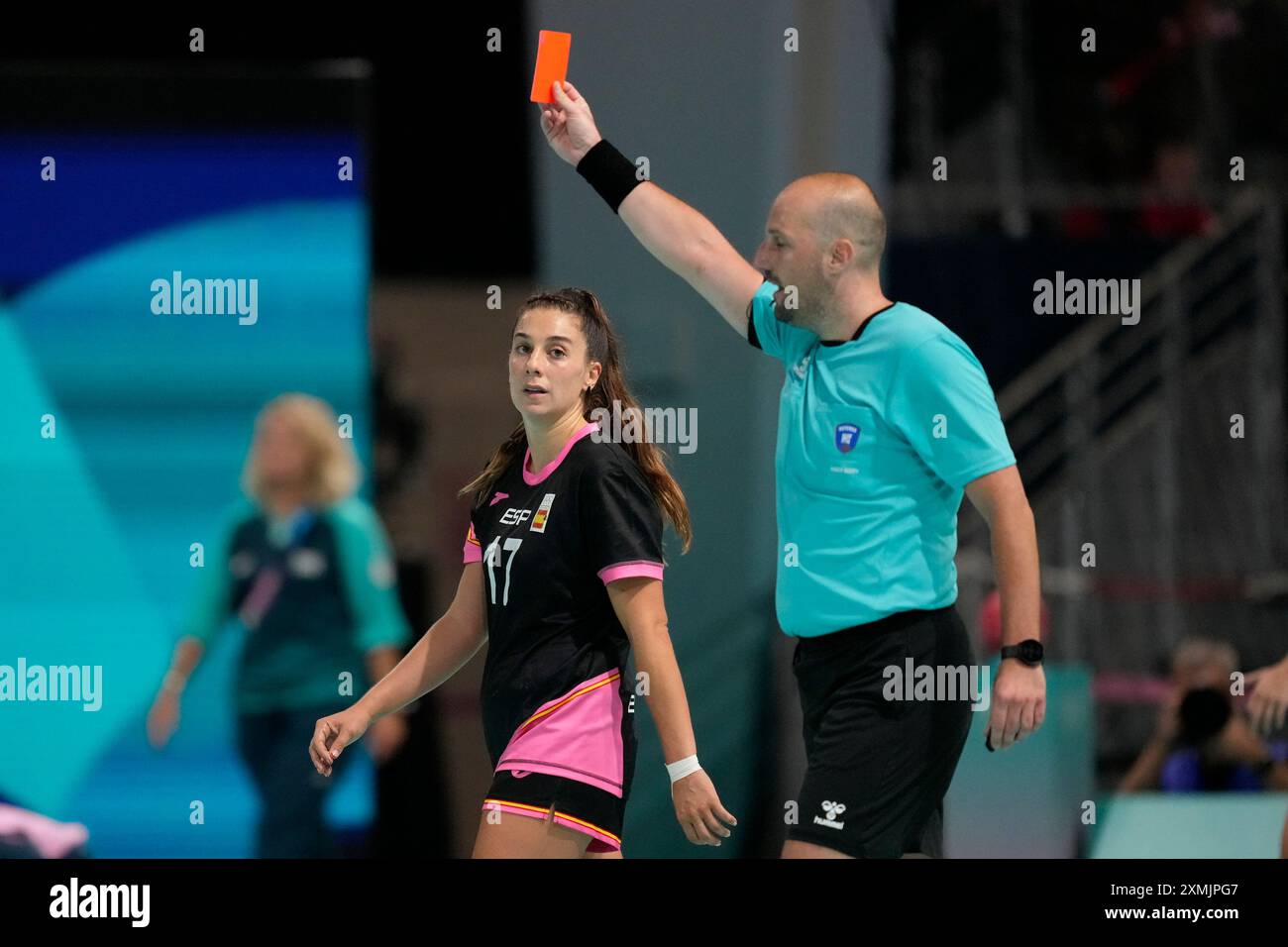 A referee raises a red card beside Jennifer Maria Gutierrez, of Spain ...