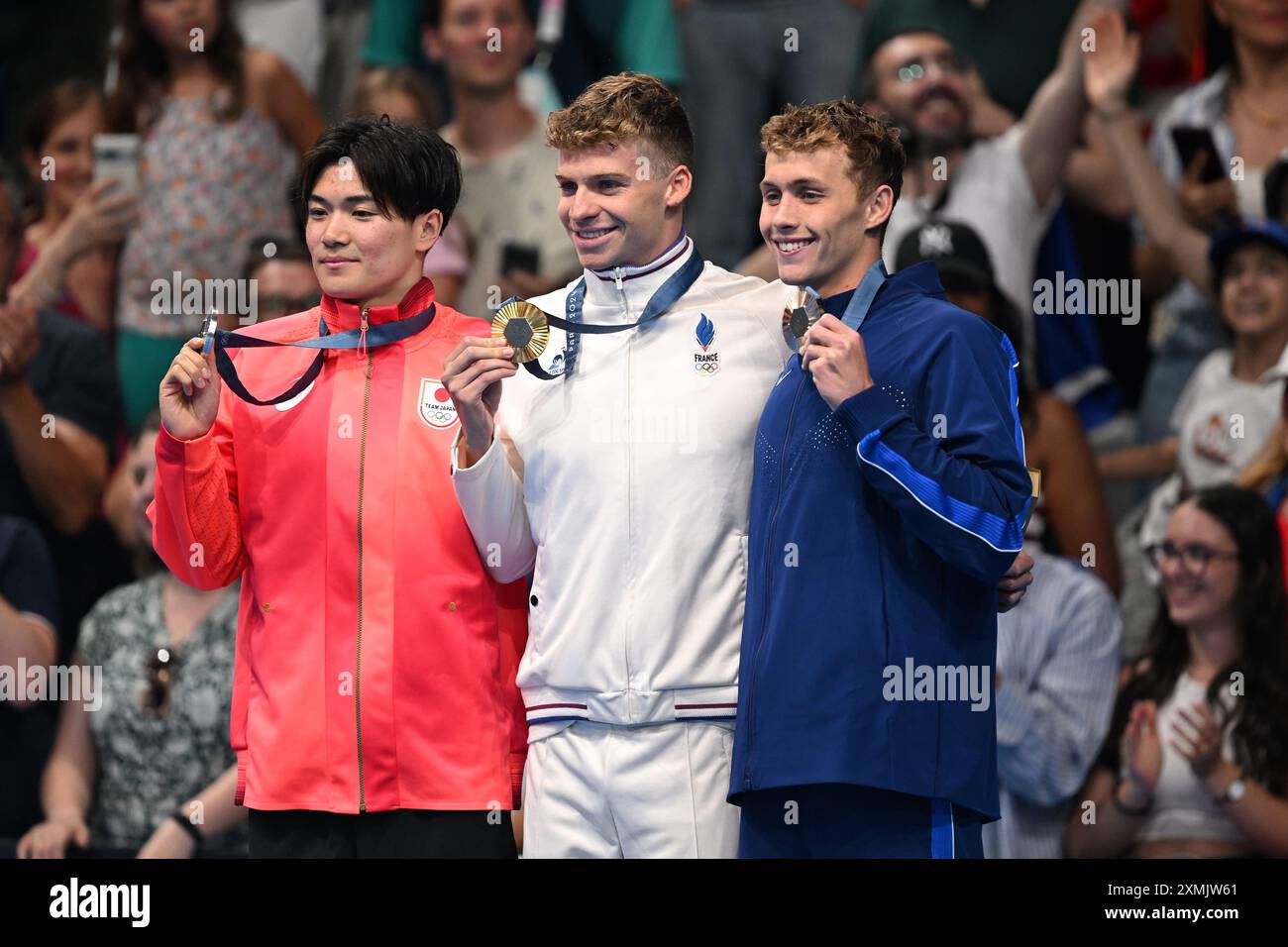 Paris, France. 28th July, 2024. French swimmer Léon Marchand (centre ...