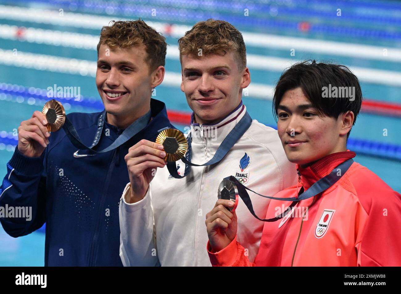 Paris, France. 28th July, 2024. French swimmer Léon Marchand (centre ...