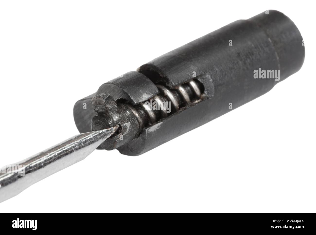 Isolated screwdriver taking the spring and spring guide out of the ...
