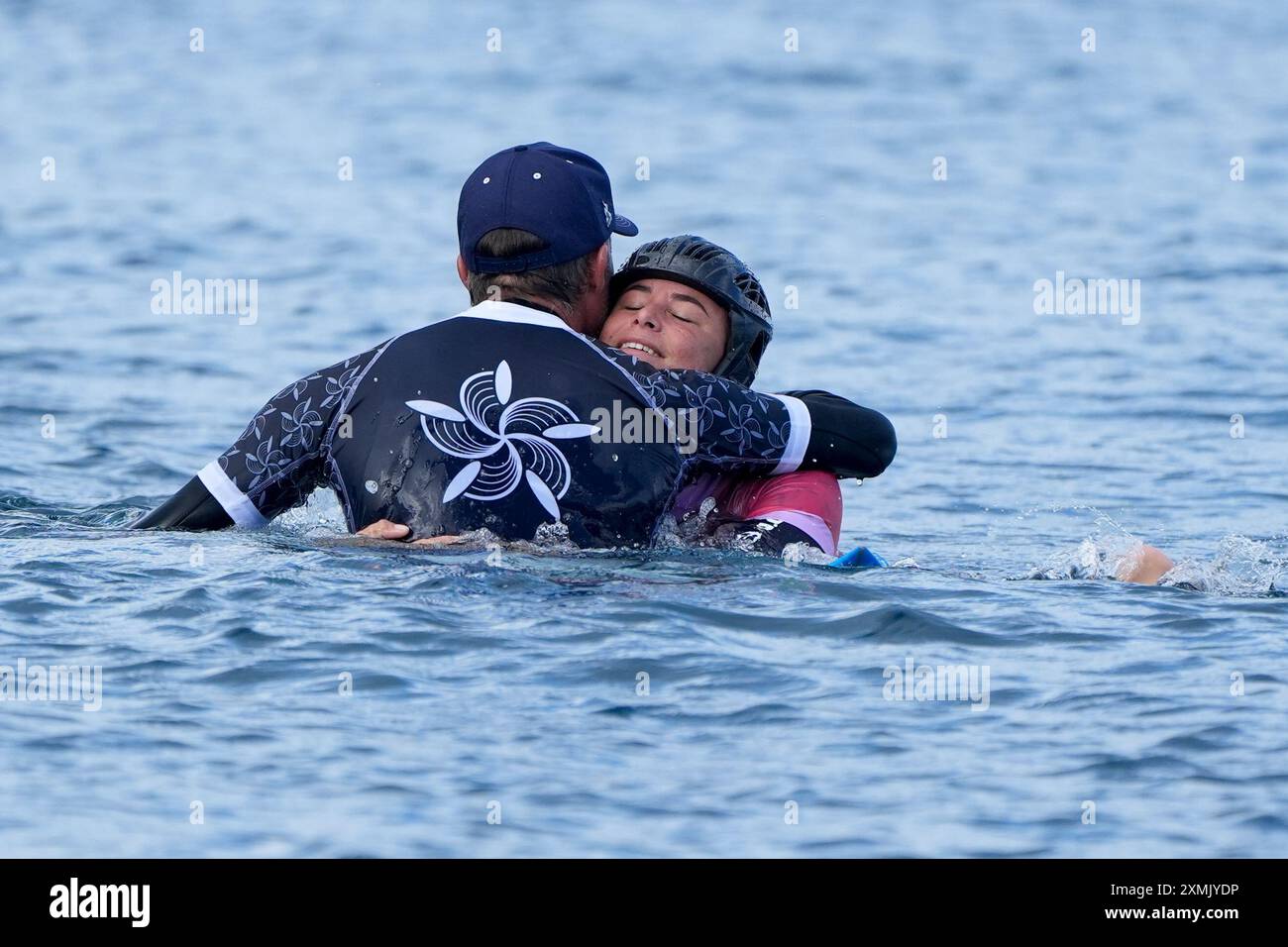 Johanne Defay, of France, hugs her husband Simon Paillard after winning ...