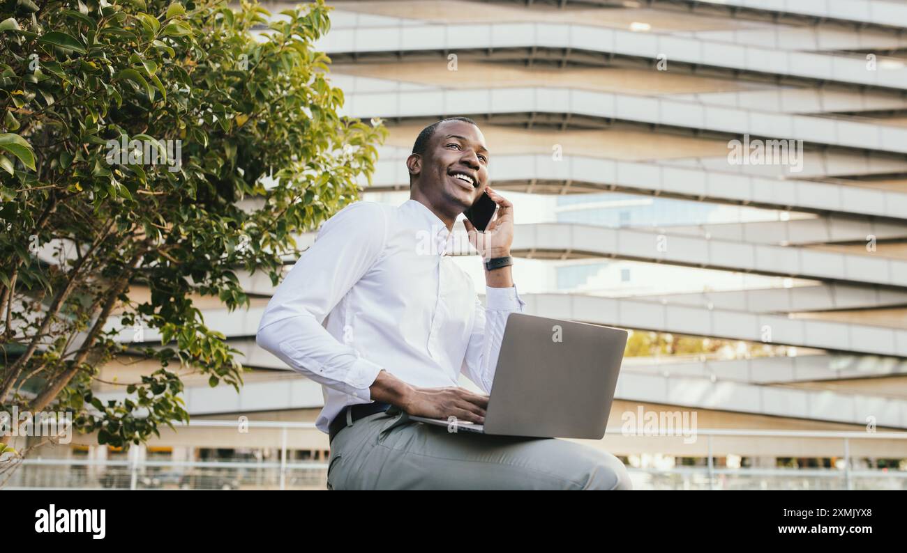 Smiling young man outside office hi-res stock photography and images ...