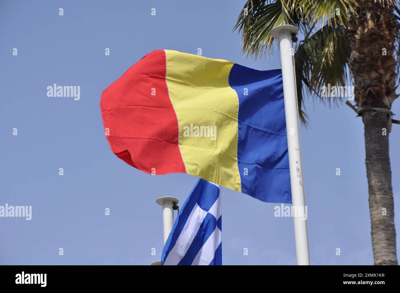 Greece and Romania flag on the flagpole Stock Photo - Alamy
