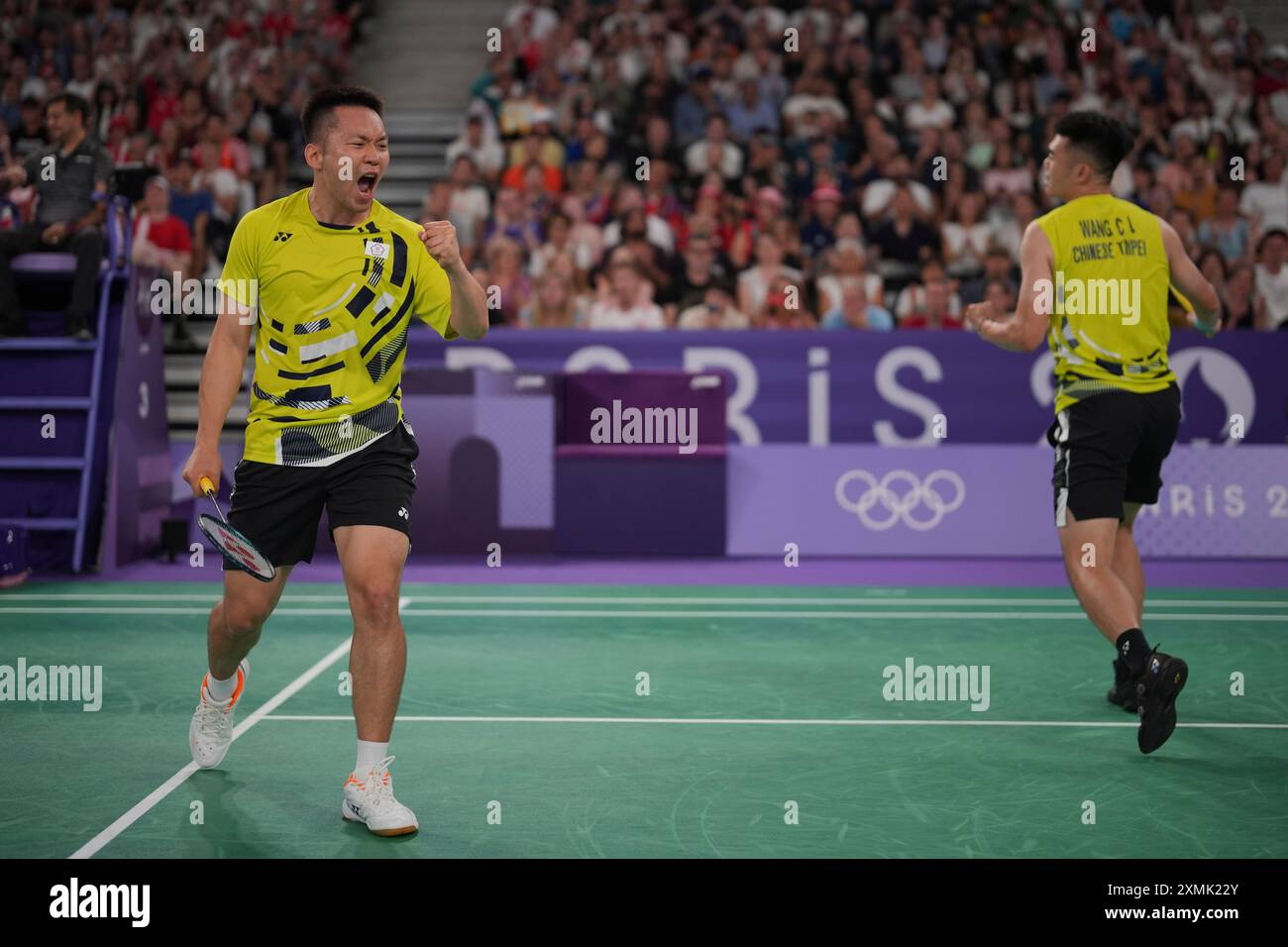 Taiwan's Lee Yang and Wang Chi-Lin react as they play against Denmark's ...