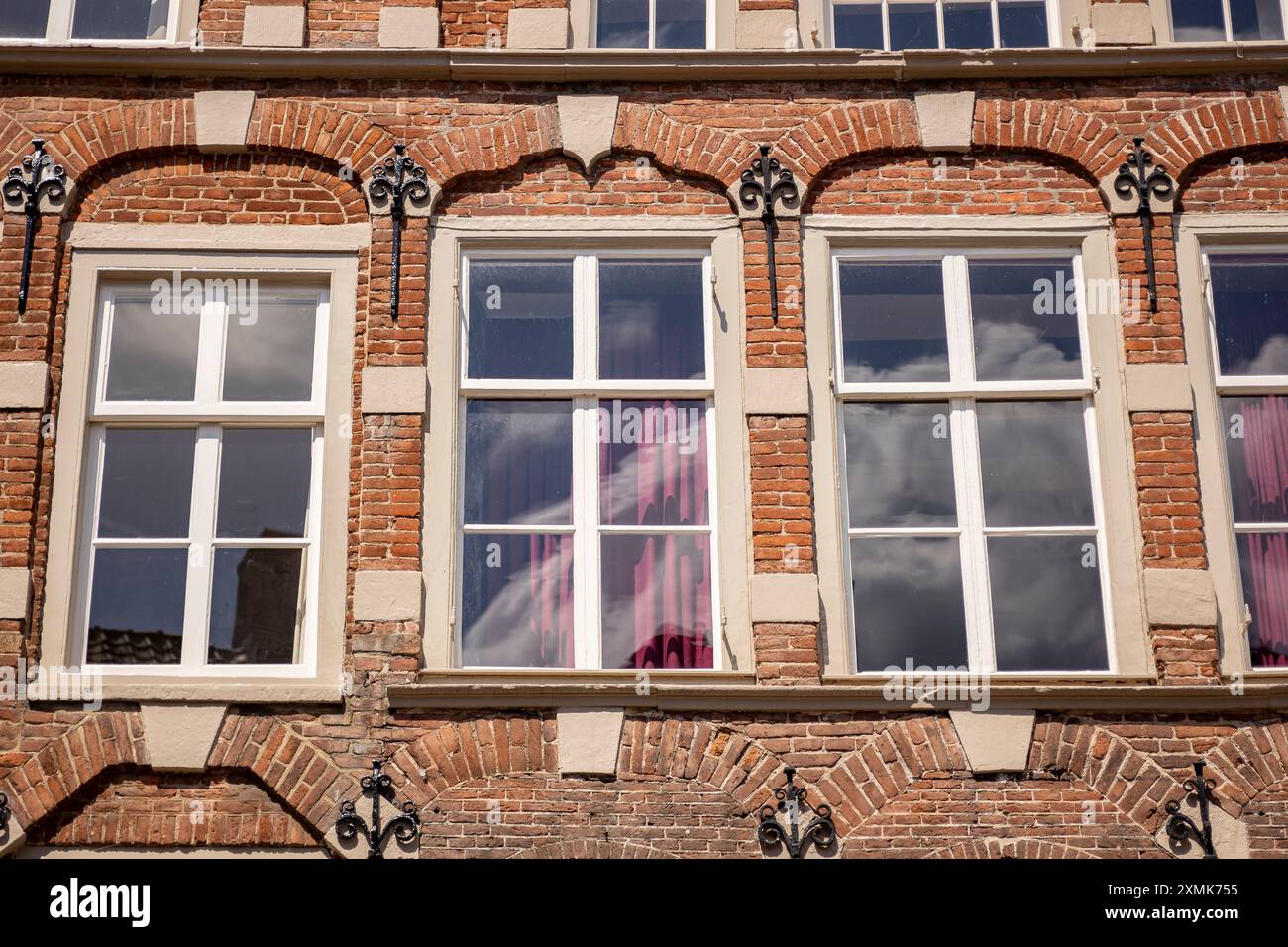 Bright frontal textured typical historic medieval exterior facades of ...