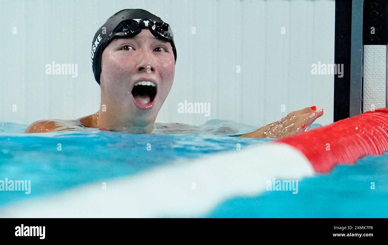 Torri Huske, of the United States, reacts after winning the women's 100 ...