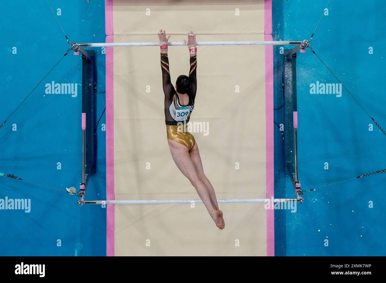 Nina Derwael, of Belgium, performs on the uneven bars during a women's ...