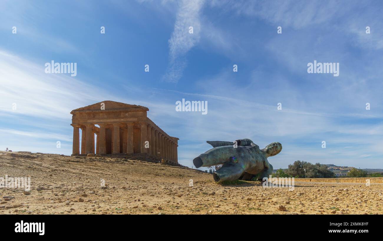 Bronze statue of fallen Icarus in front of Temple of Concordia in the ...