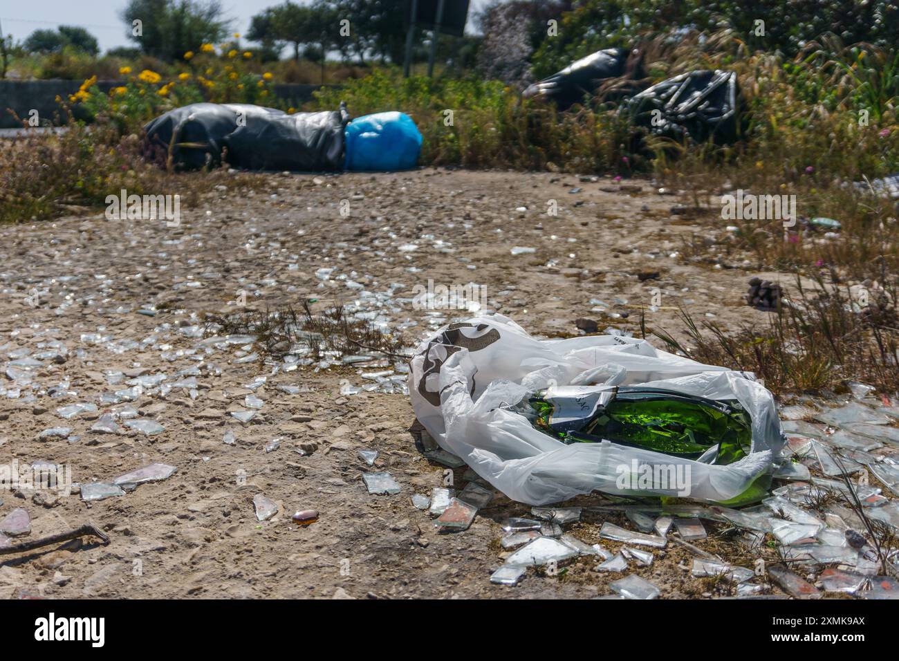 Waste of plastic bags dumped at roadside in Sicily, Italy Stock Photo ...