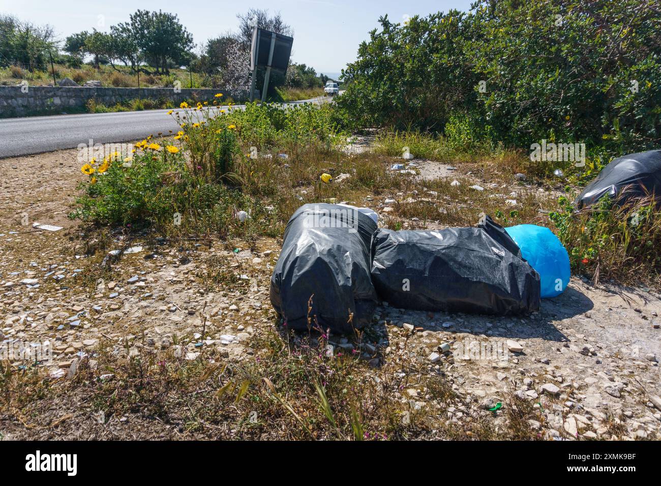Waste of plastic bags dumped at roadside in Sicily, Italy Stock Photo ...