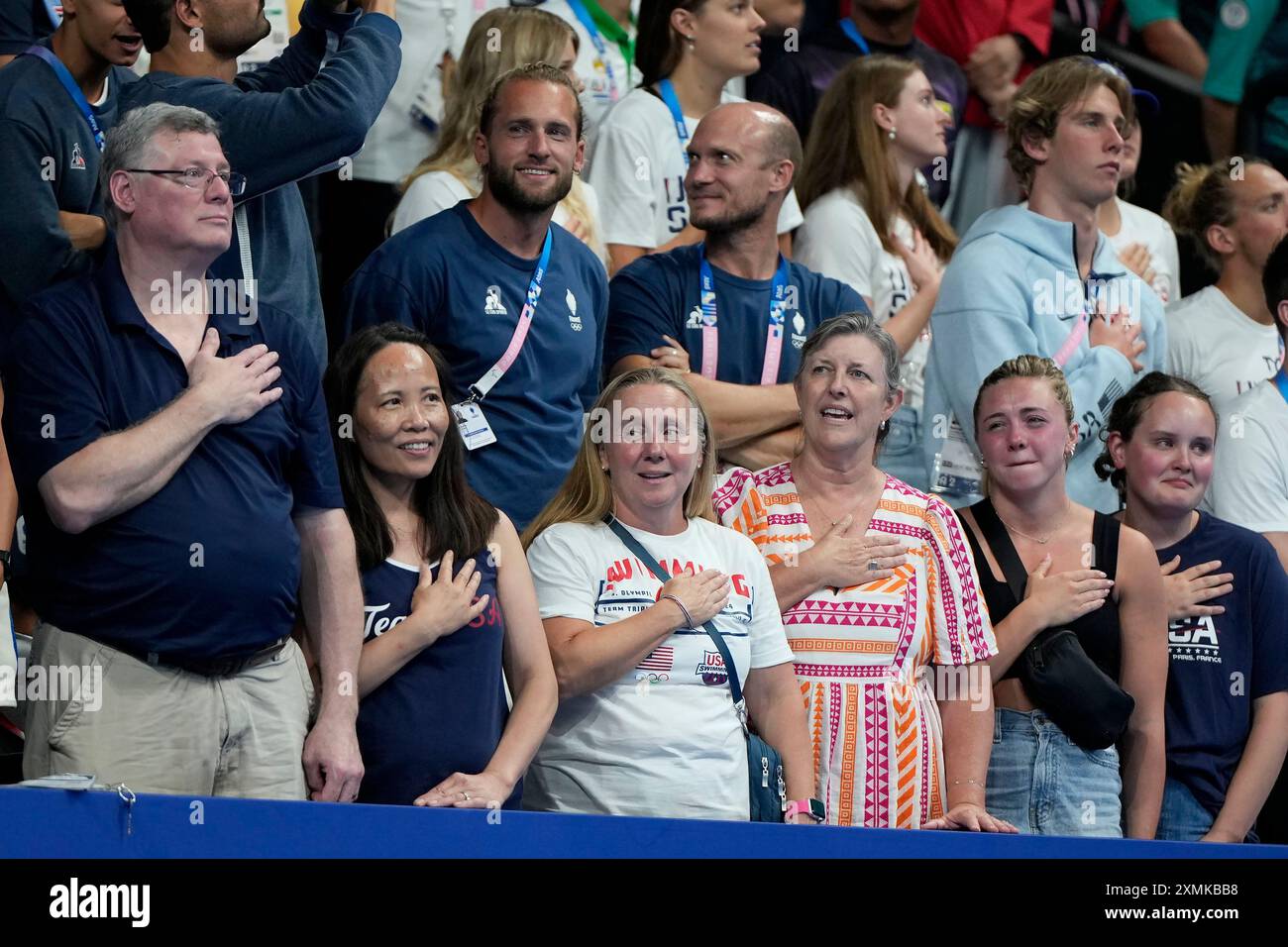 The family of Torri Huske, of the United States, reacts as she receives ...