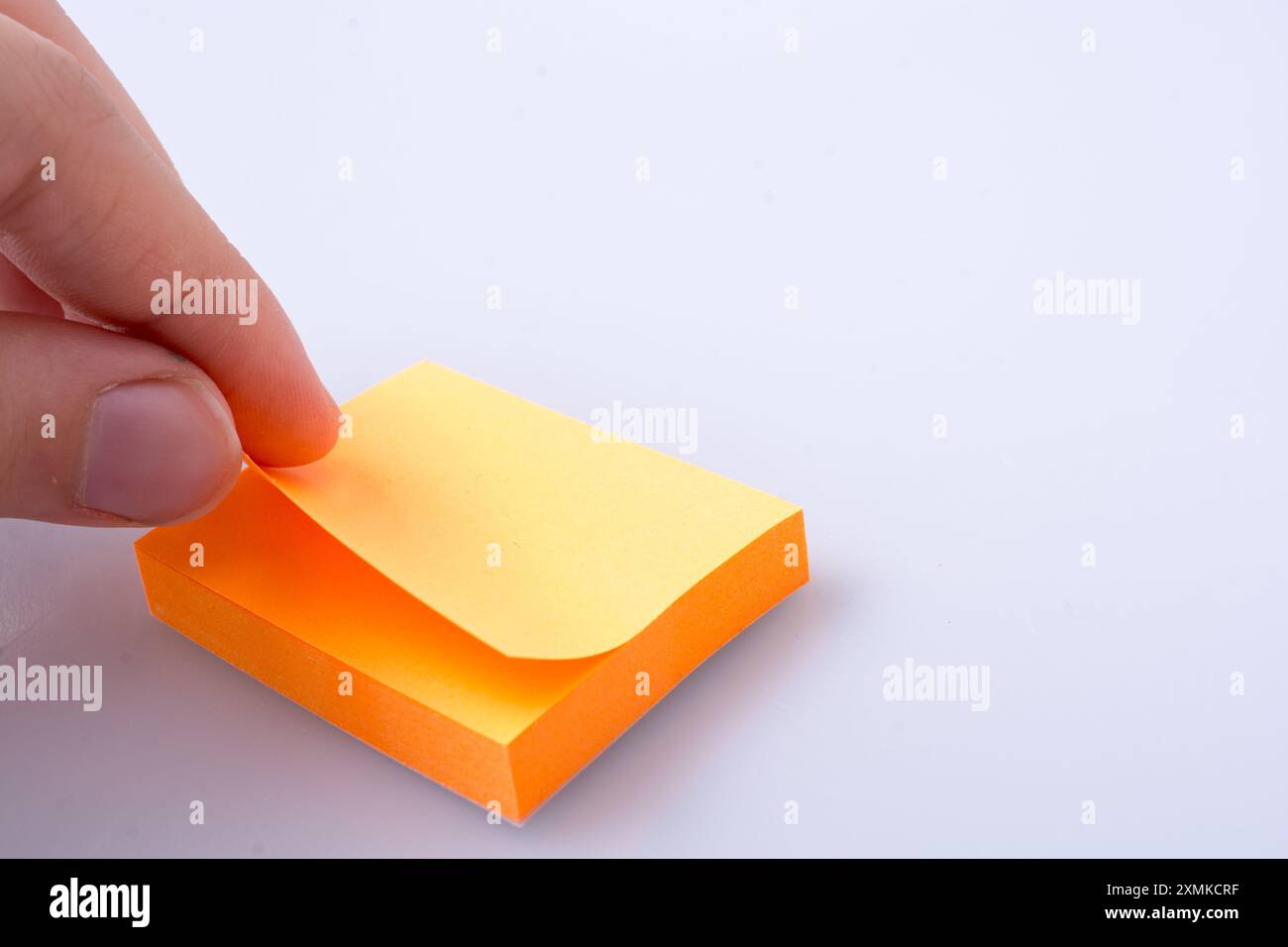 Post note office sticker for taking notes in hand Stock Photo - Alamy