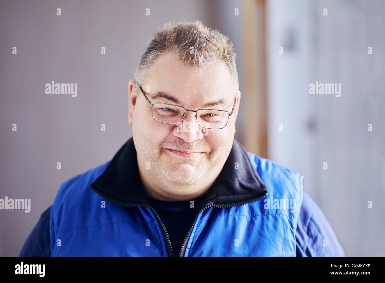 Grinning thick-cheeked European man in her 40s wearing glasses Stock ...