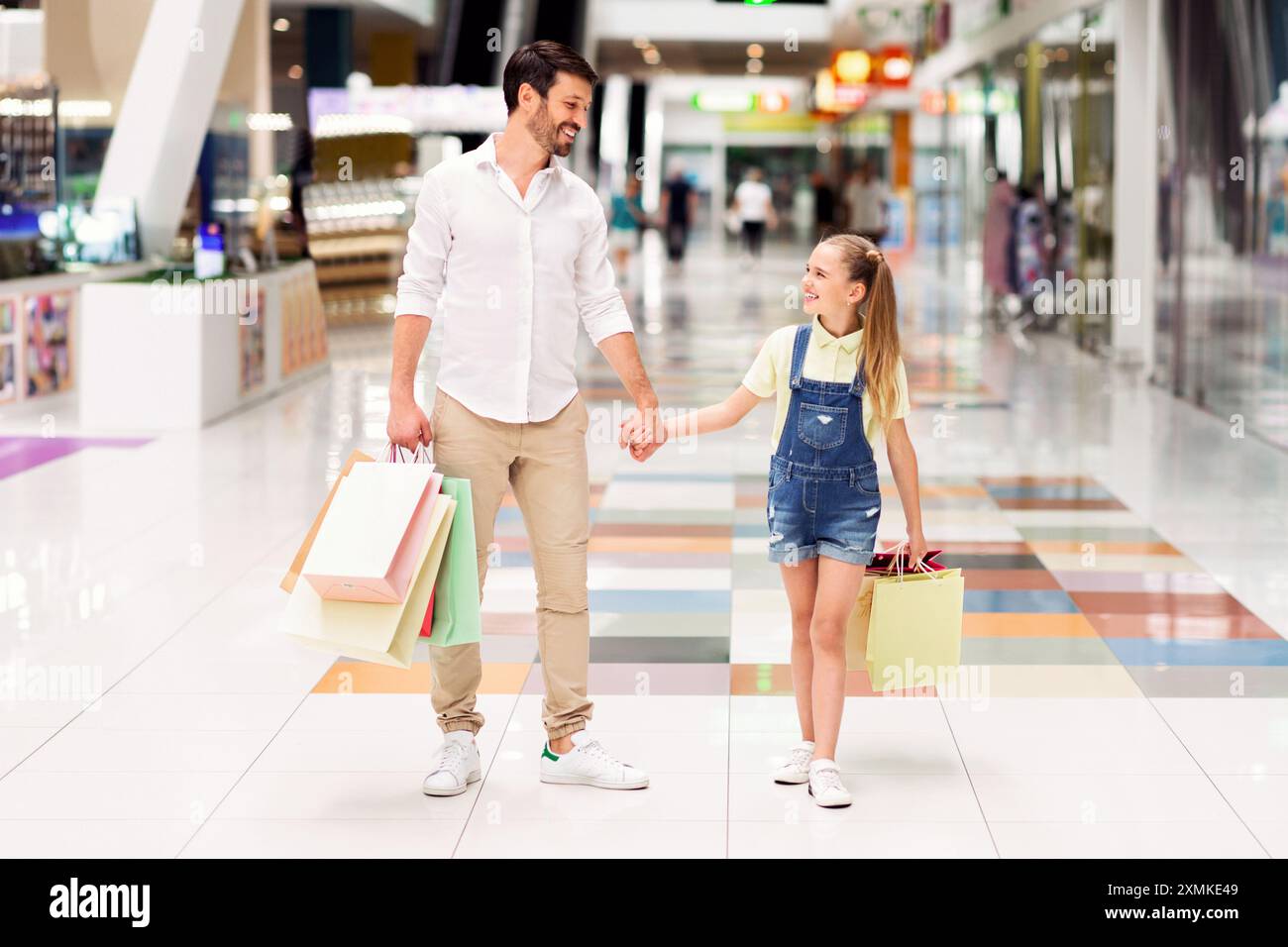 Happy Father and Daughter Shopping Together in a Mall Stock Photo - Alamy