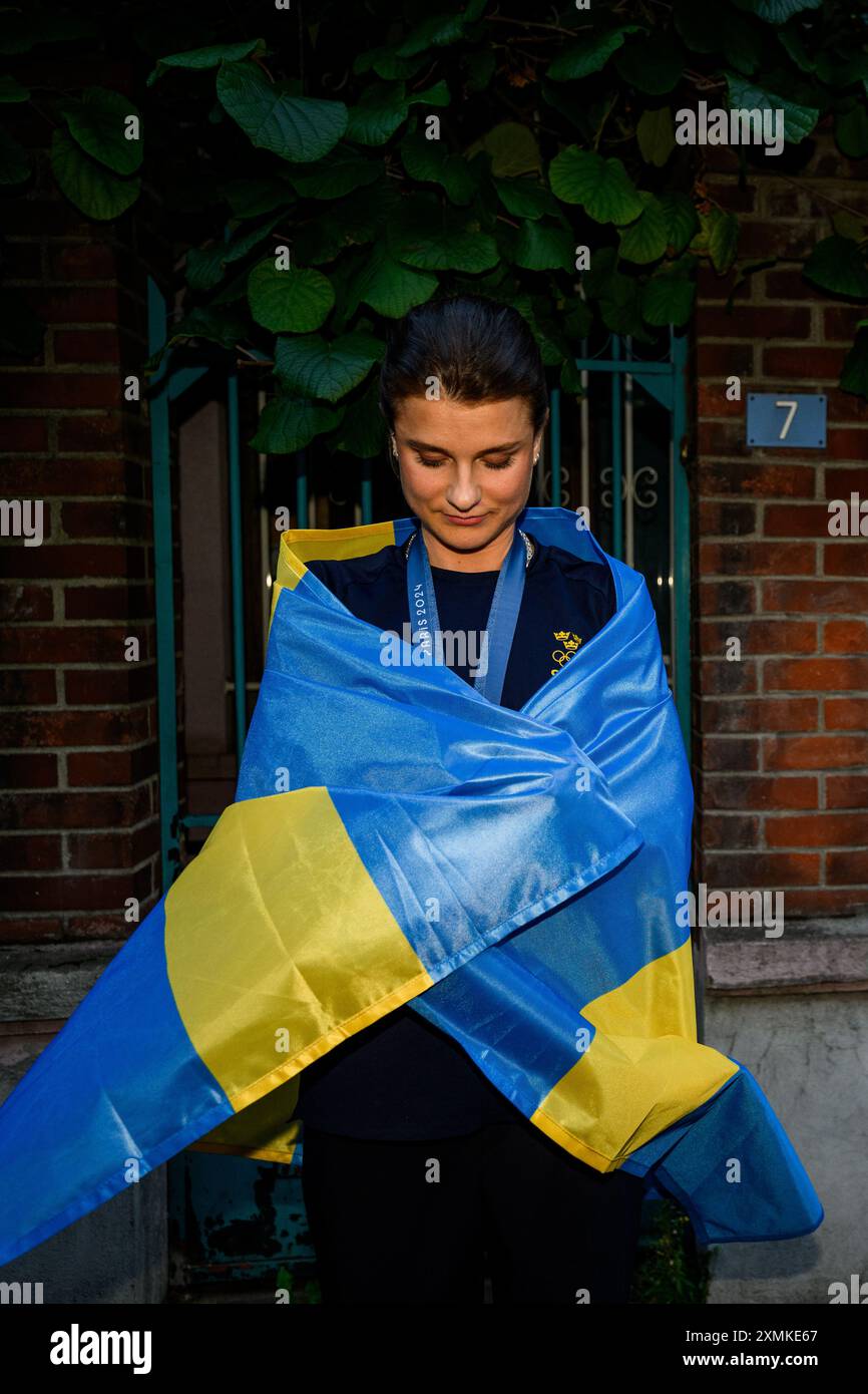 Jenny Rissveds of, Sweden. , . poses for a portrait with the swedish flag after winning a bronze ...