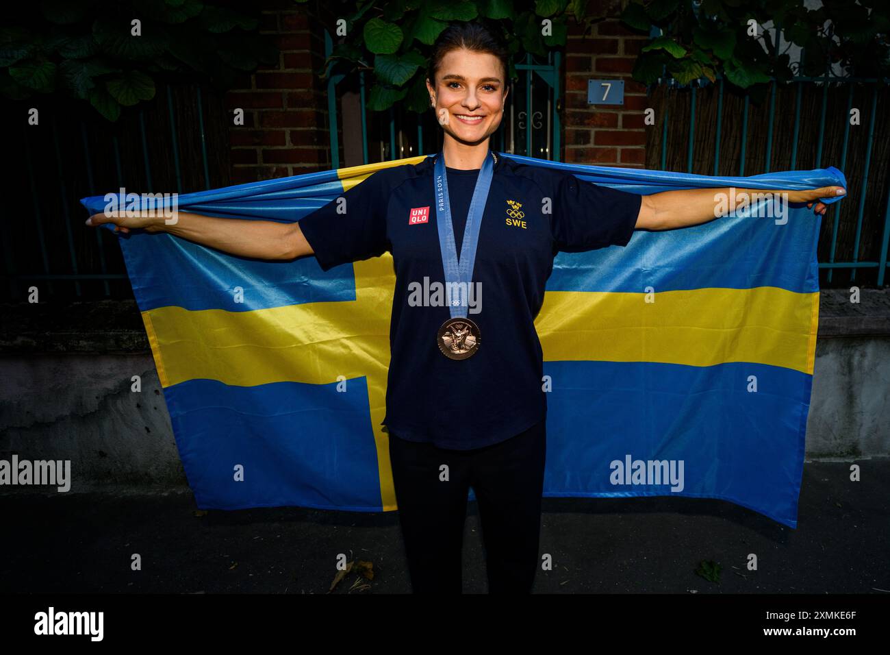Jenny Rissveds of, Sweden. , . poses for a portrait with the swedish flag after winning a bronze ...