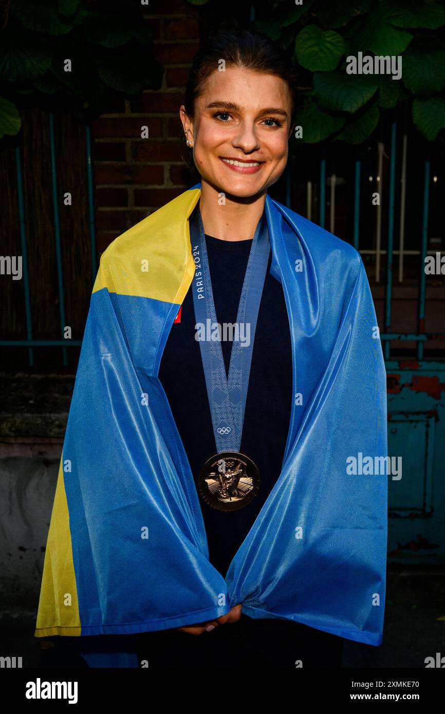 Jenny Rissveds of, Sweden. , . poses for a portrait with the swedish flag after winning a bronze ...