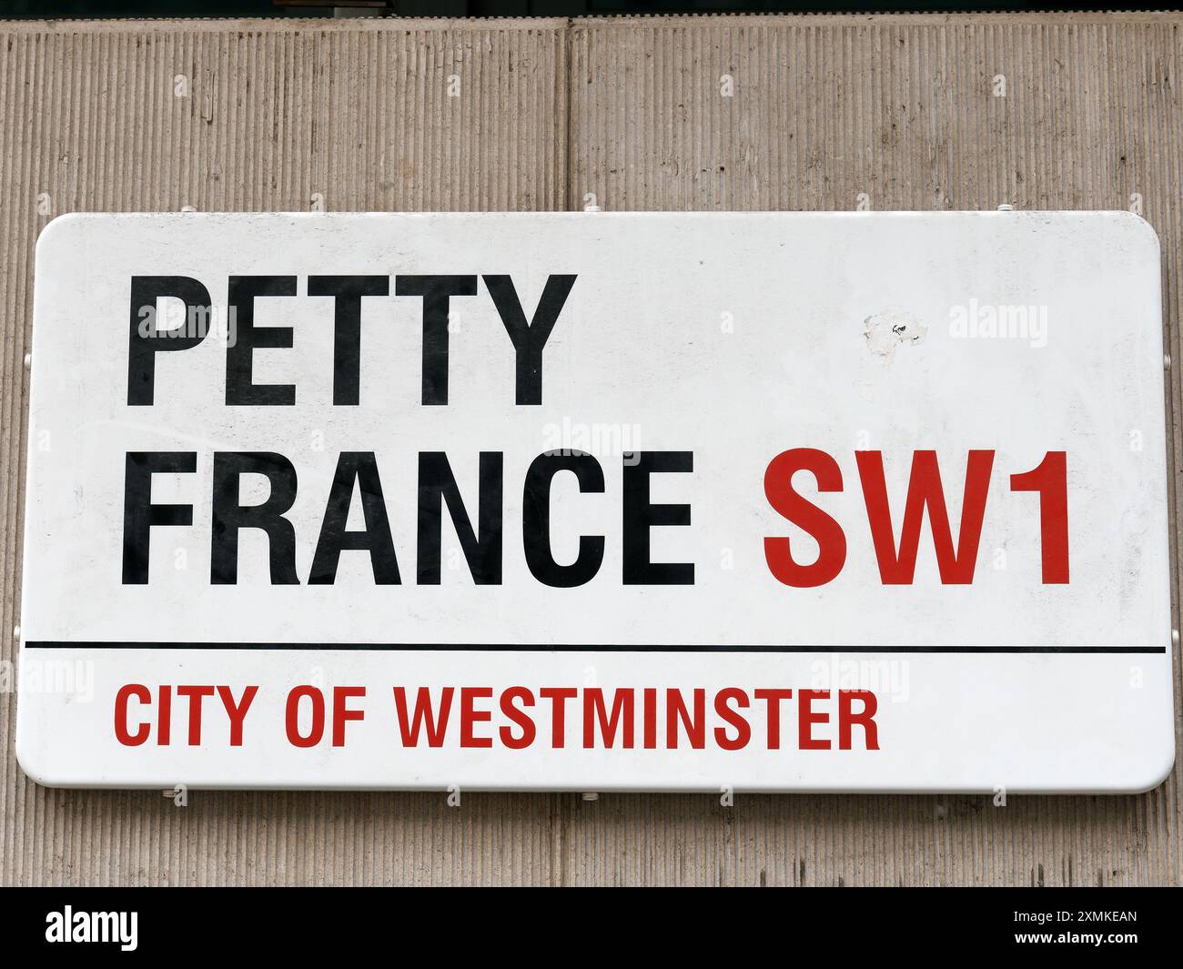 Close-up view looking up at a street sign in Petty France in London UK ...