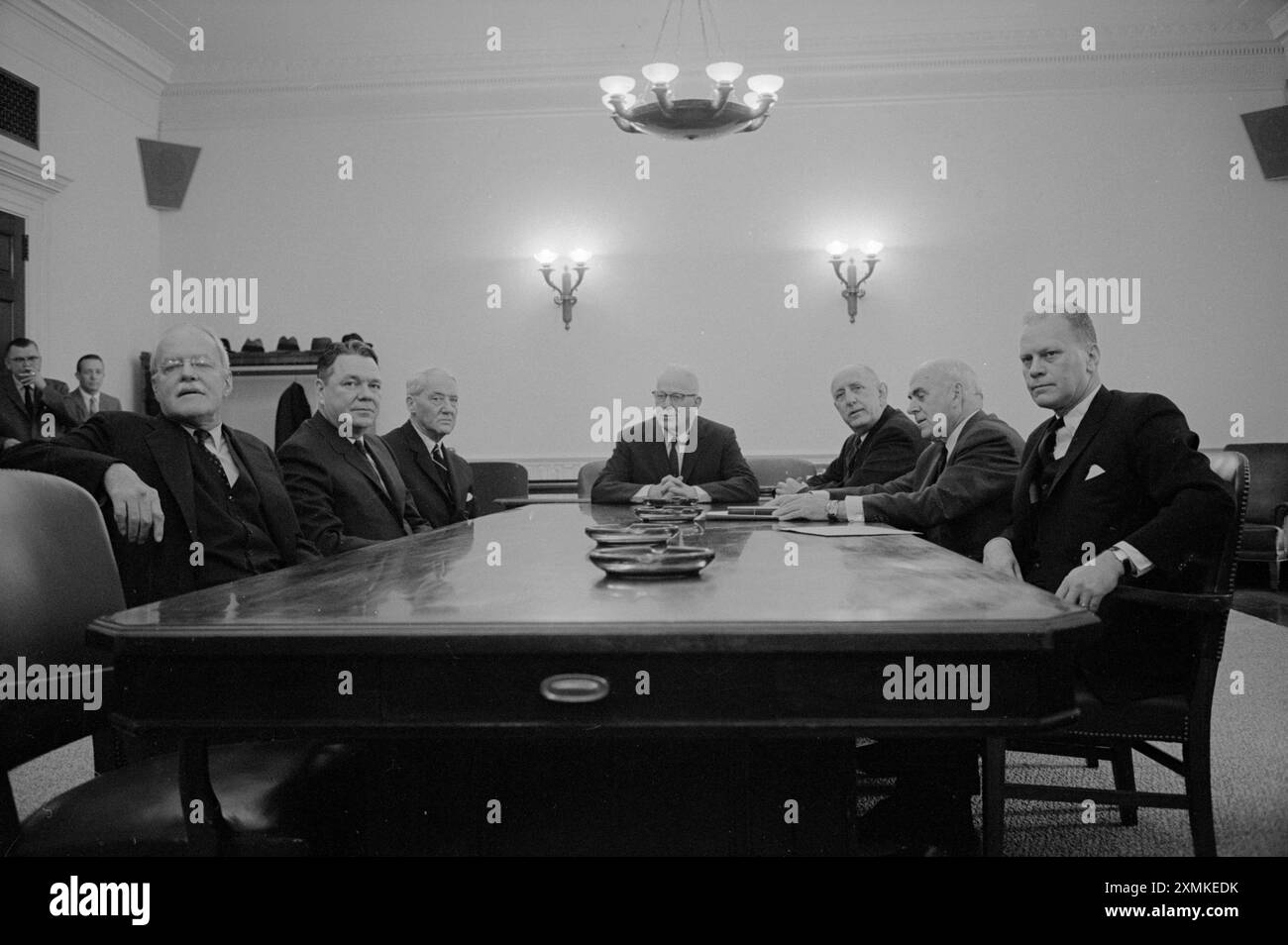 Members of the Warren Commission gathered around a table including ...