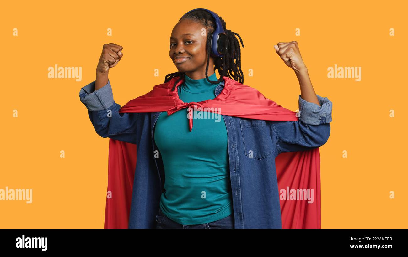 African american superhero with red cape flexing muscles, isolated over ...