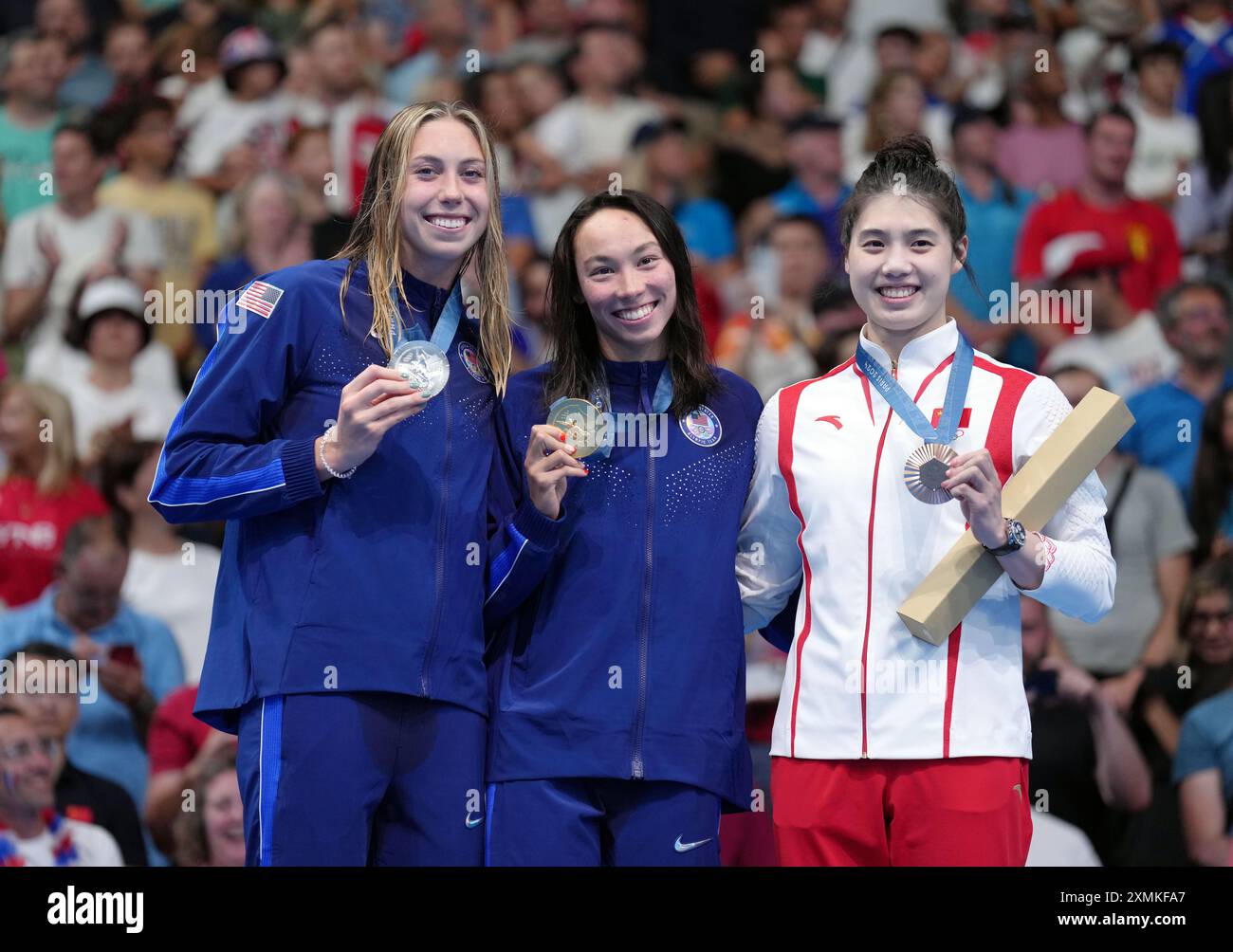 Paris, France. 28th July, 2024. Gold medalist Torri Huske (C) of the ...