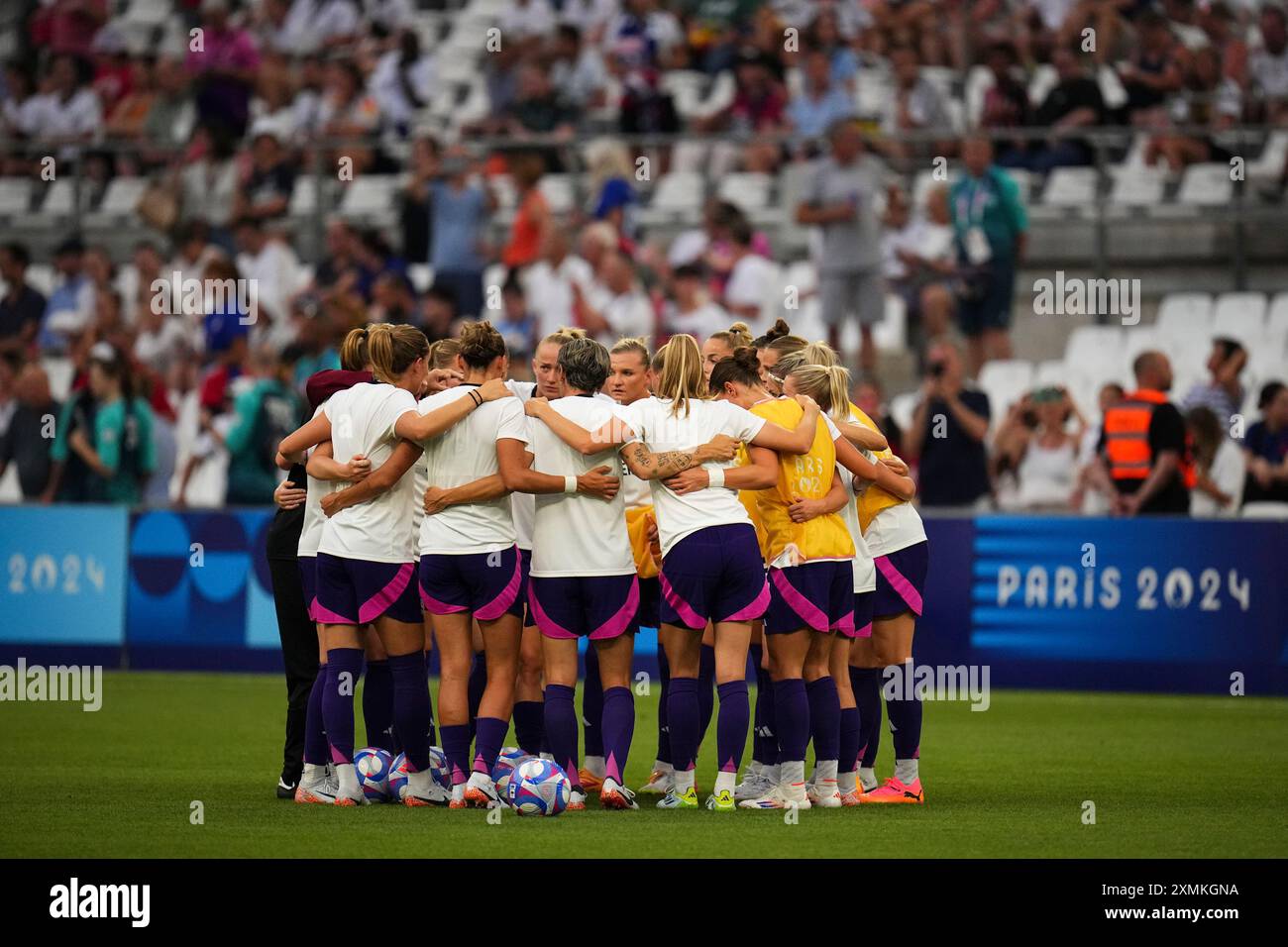 The German women's soccer team huddle together before the start of the ...