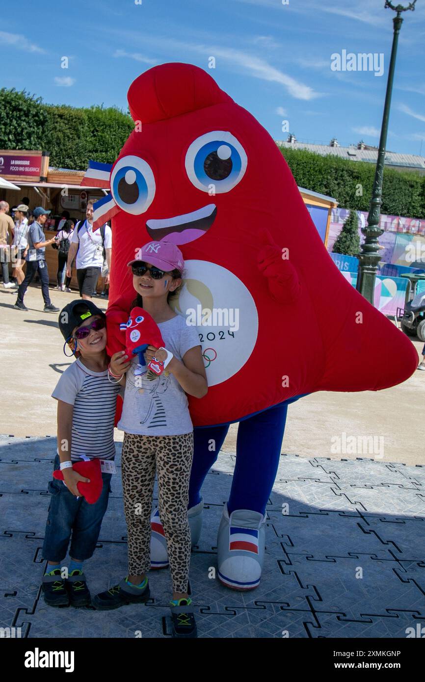 Paris, France. 28th July, 2024. Fans take photos with 2024 Paris mascot ...