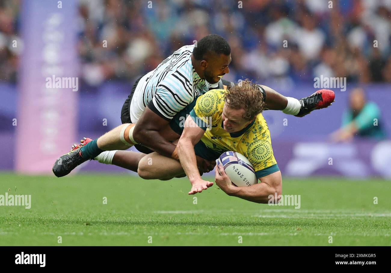 PARIS, FRANCE - JULY 27: Sevuloni Mocenacagi of Team Fiji tackles Henry ...