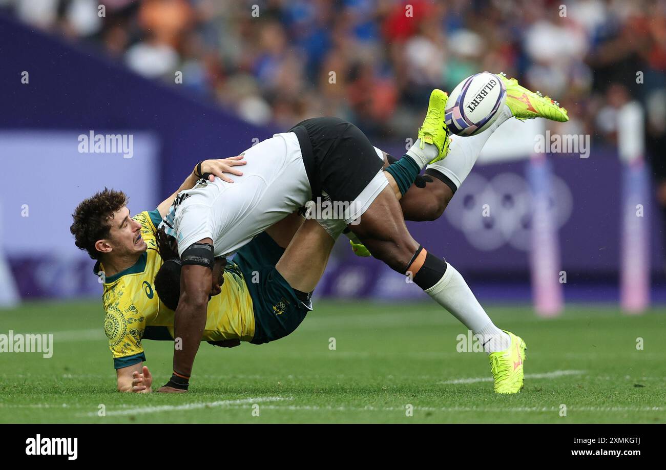 PARIS, FRANCE - JULY 27: Kaminieli Rasaku of Team Fiji tackles Ben ...