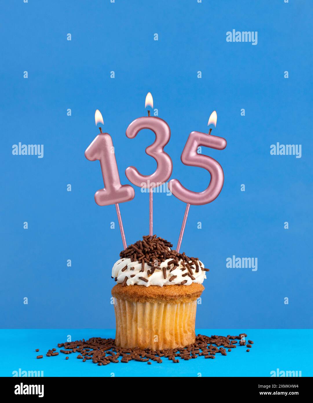 Birthday candle with cupcake on blue background - Number 135 Stock ...
