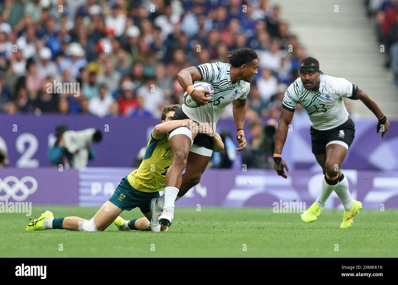 PARIS, FRANCE - JULY 27: Ben Dowling of Team Australia tackles Iosefo ...