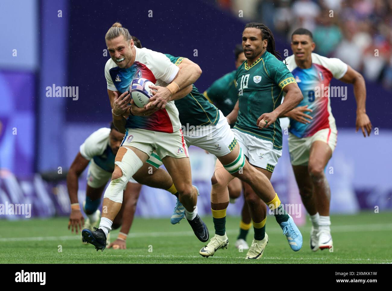 PARIS, FRANCE - JULY 27: Impi Visser of Team South Akfrica tackles ...