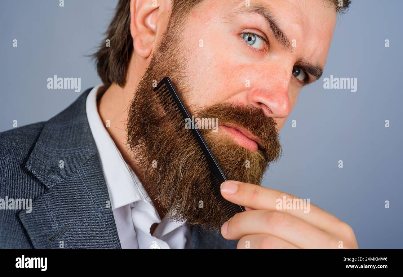 Hairdresser combing man hair in hi-res stock photography and images - Alamy