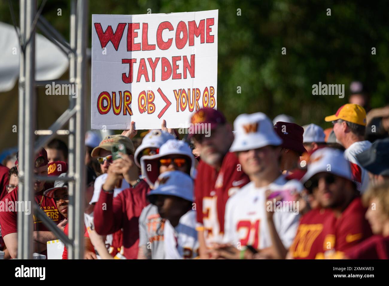 Ashburn, VA, USA. 28th July, 2024. Washington Commanders fans hold up a ...