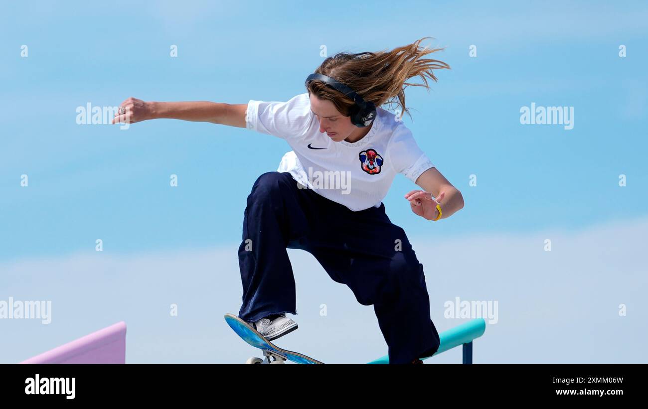 Poe Pinson, of the United States, performs a trick on the rail during ...