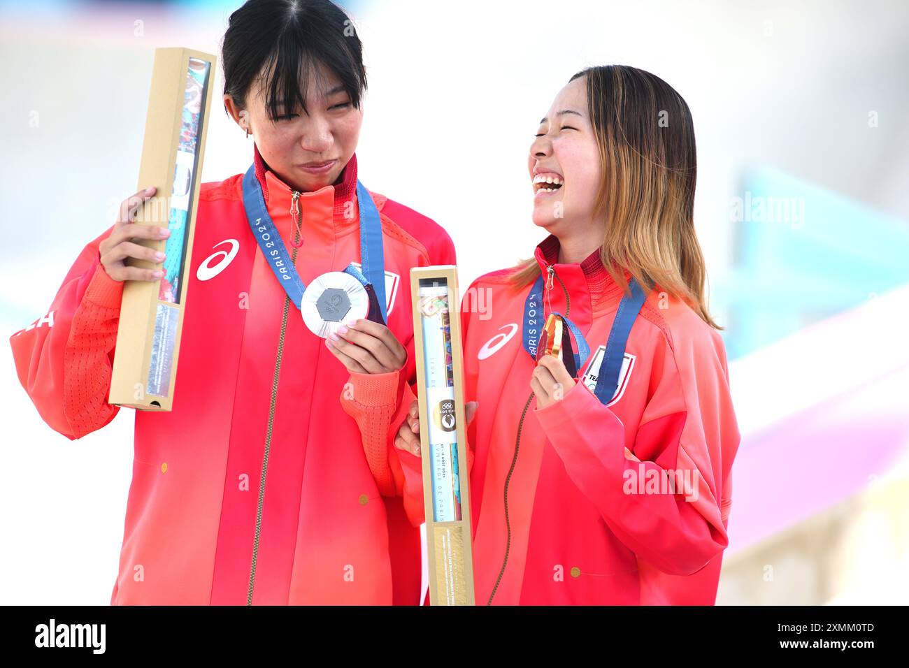 Liz AKAMA (L) and Coco YOSHIZAWA (R) of Japan share a laugh while ...