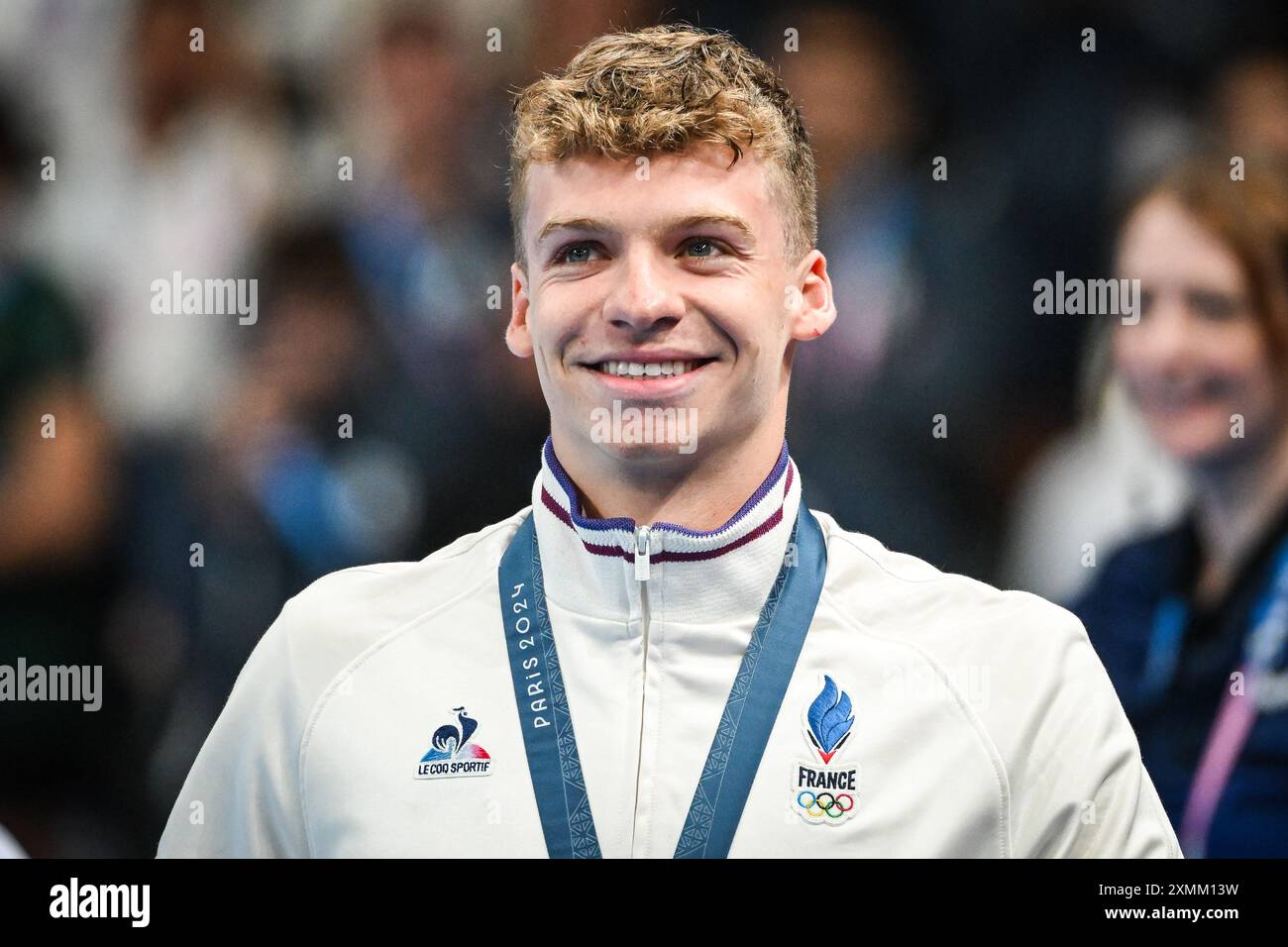 Nanterre, France. 28th July, 2024. MARCHAND Leon of France celebrates ...