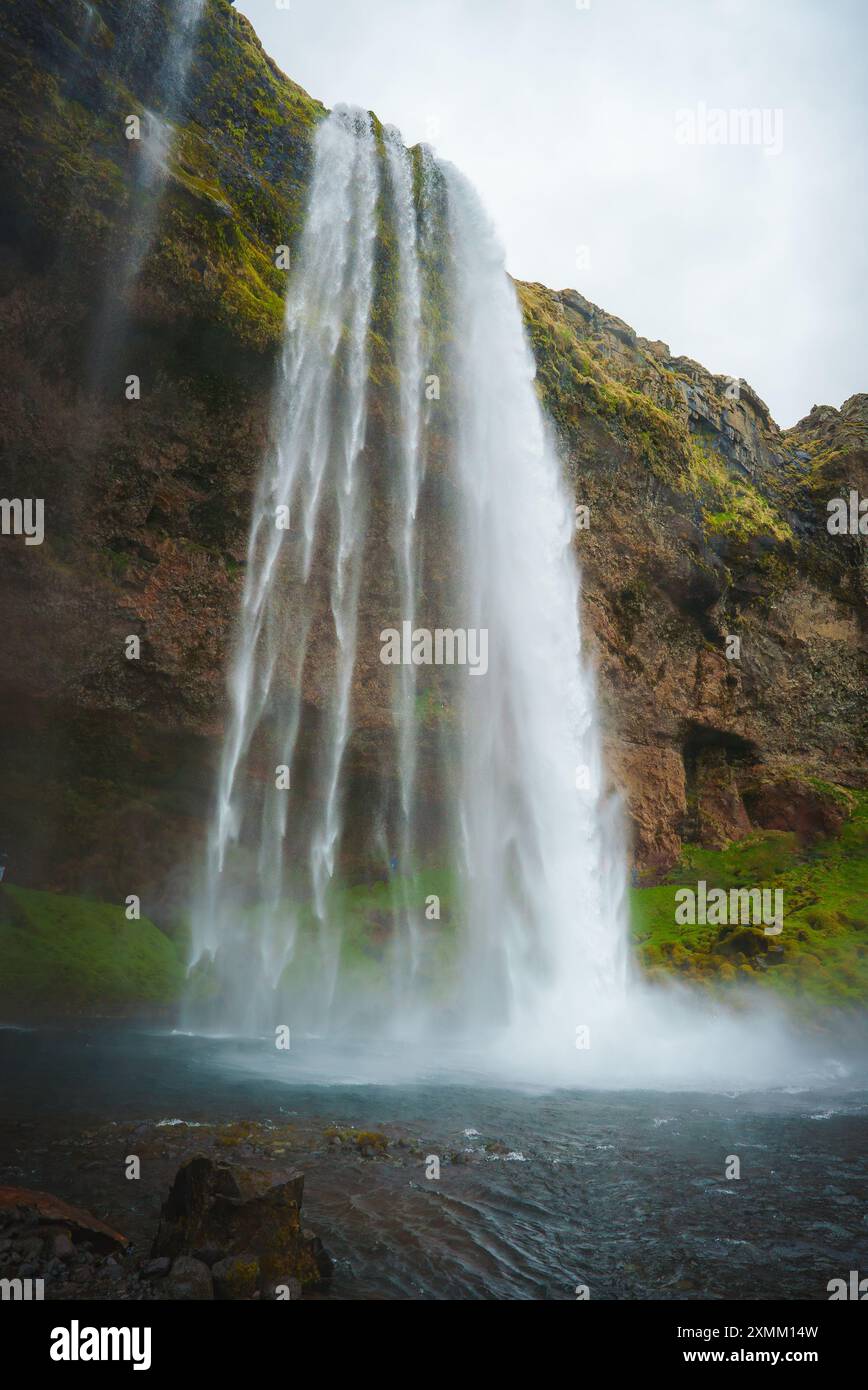 Seljalandsfoss Waterfall with Lush Green Moss and Rugged Rock ...