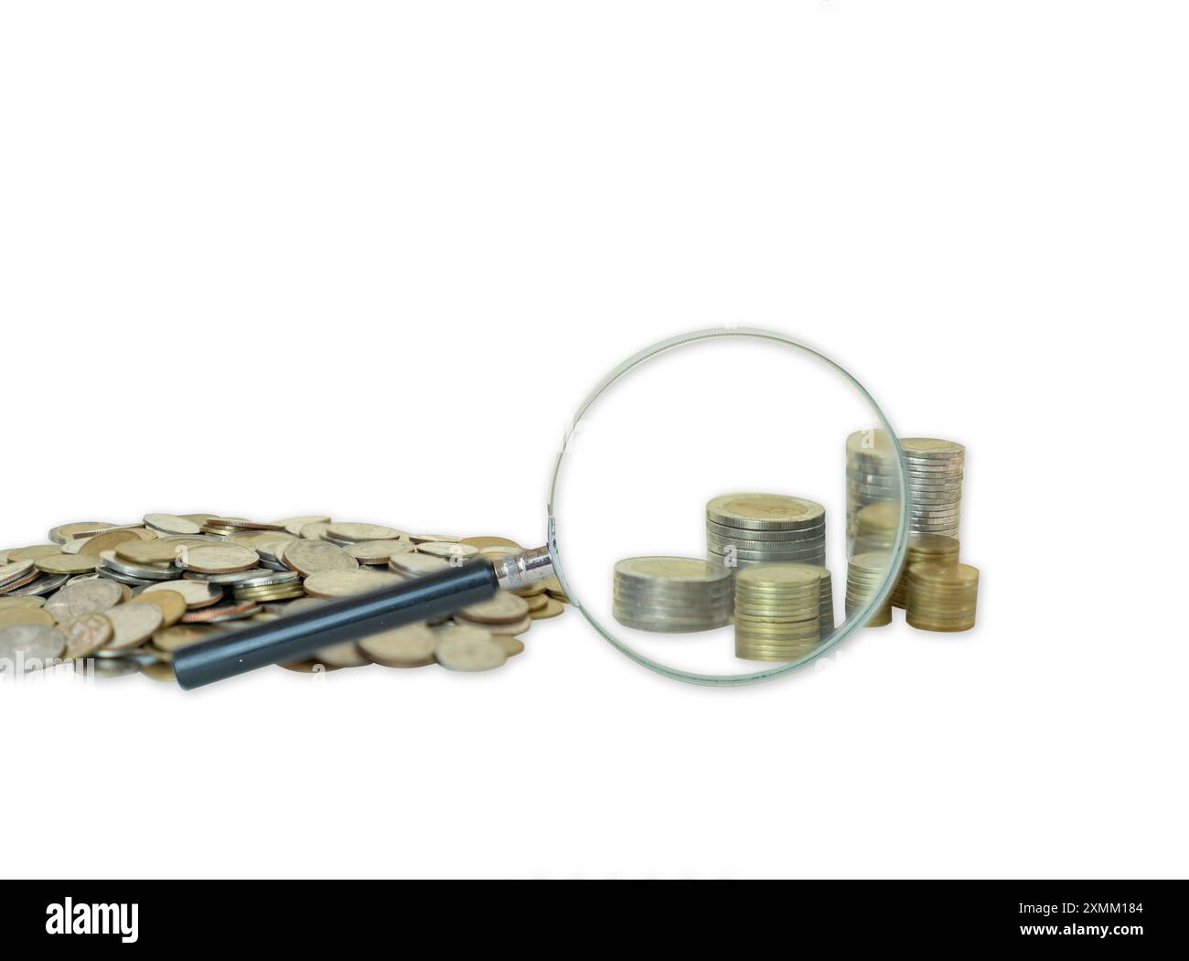 Magnify glass zoom coin stack, concept saving money Stock Photo - Alamy