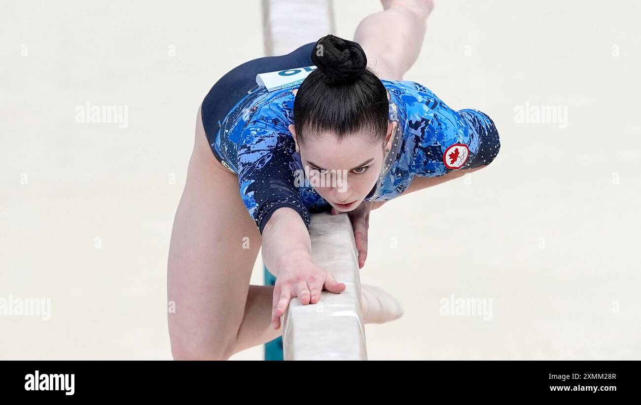 Ava Stewart, of Canada, competes on the balance beam during a women's ...