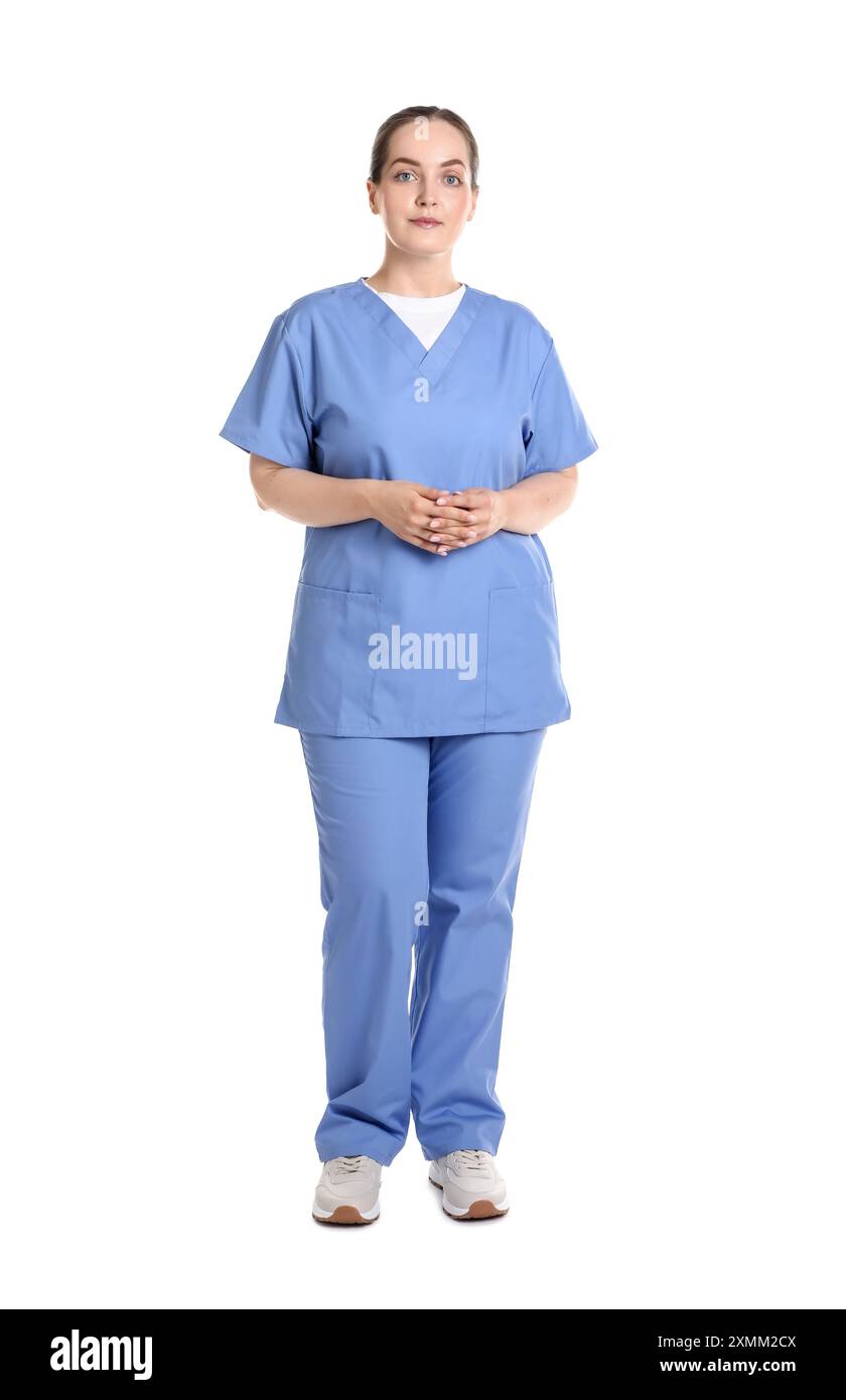 Full length portrait of professional nurse in uniform on white ...
