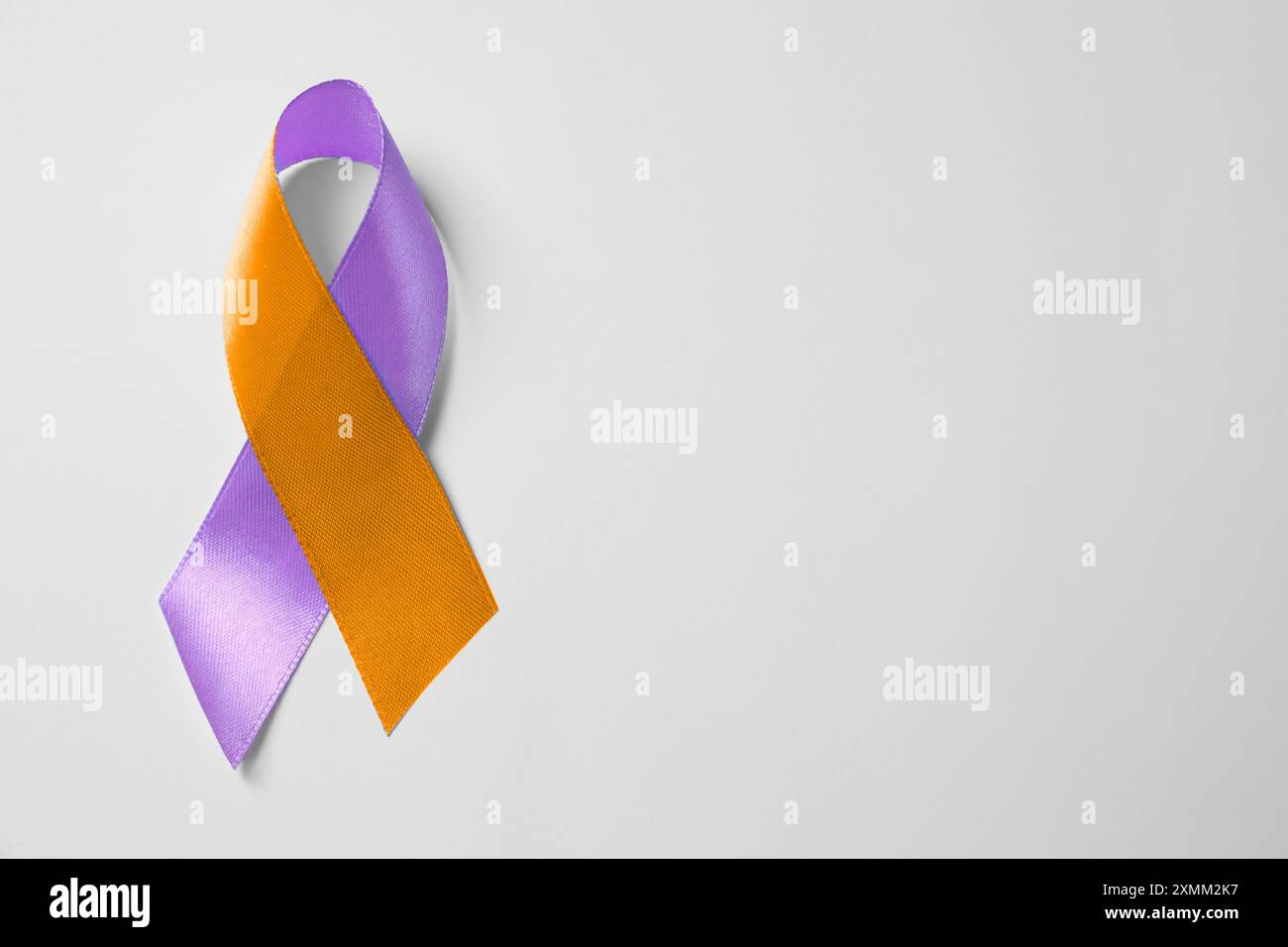 World Psoriasis Day. Orange and orchid awareness ribbon as symbol of ...